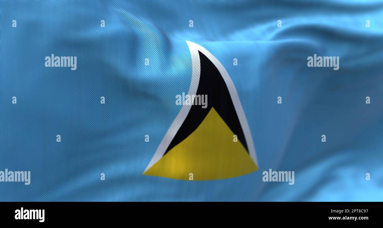 Close-up view of Saint Lucia national flag waving in the wind. Saint ...