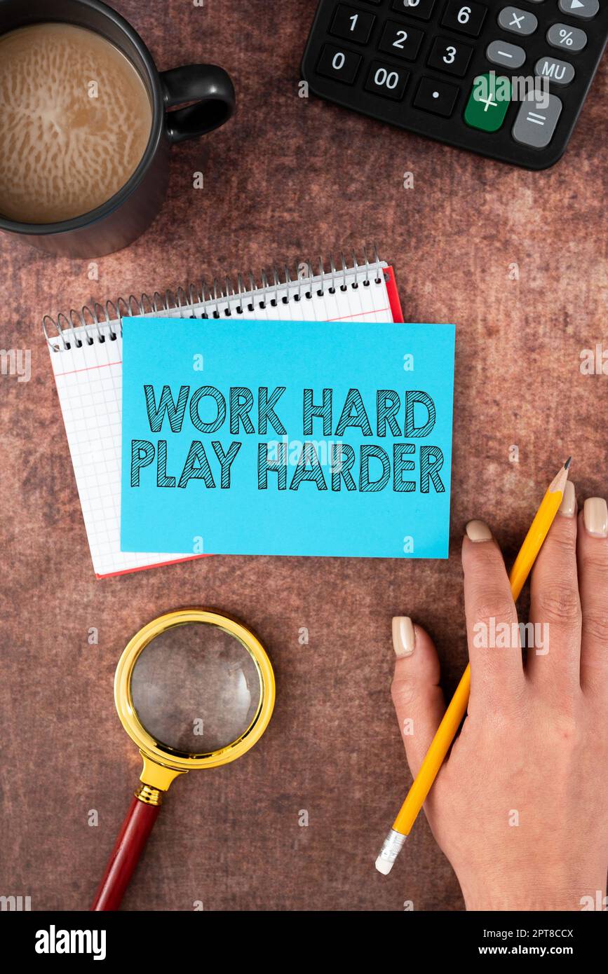 Sign displaying Work Hard Play Harder, Concept meaning a Balance Life ...