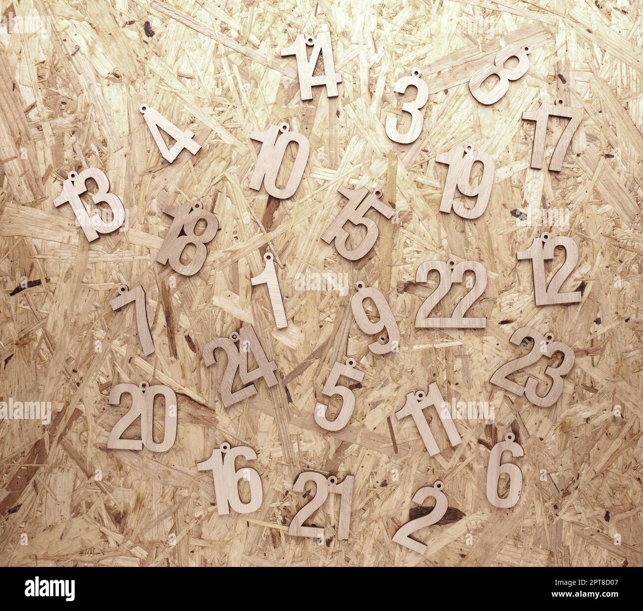 Wooden numbers from one to 24 as an Advent calendar on an OSB board ...