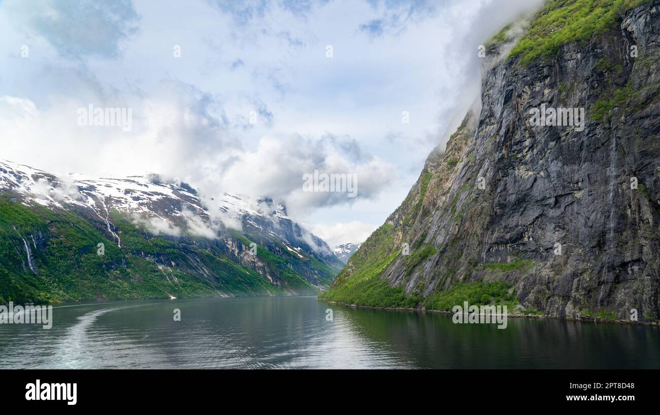 Beautiful landscape with snowy mountain peaks and waterfalls in ...