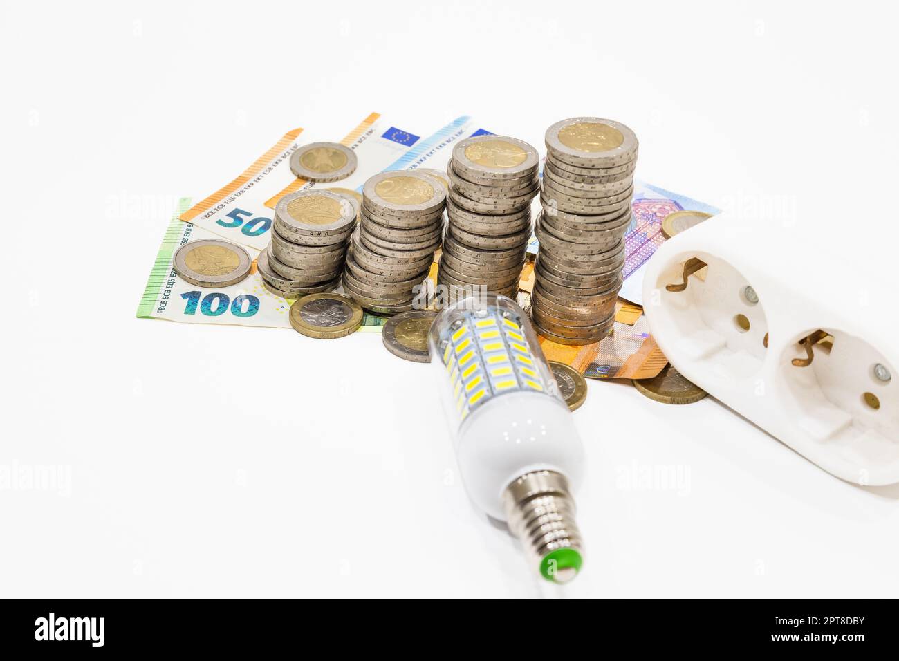 Light bulb, electric plug, and the euro money banknotes. Increasing ...