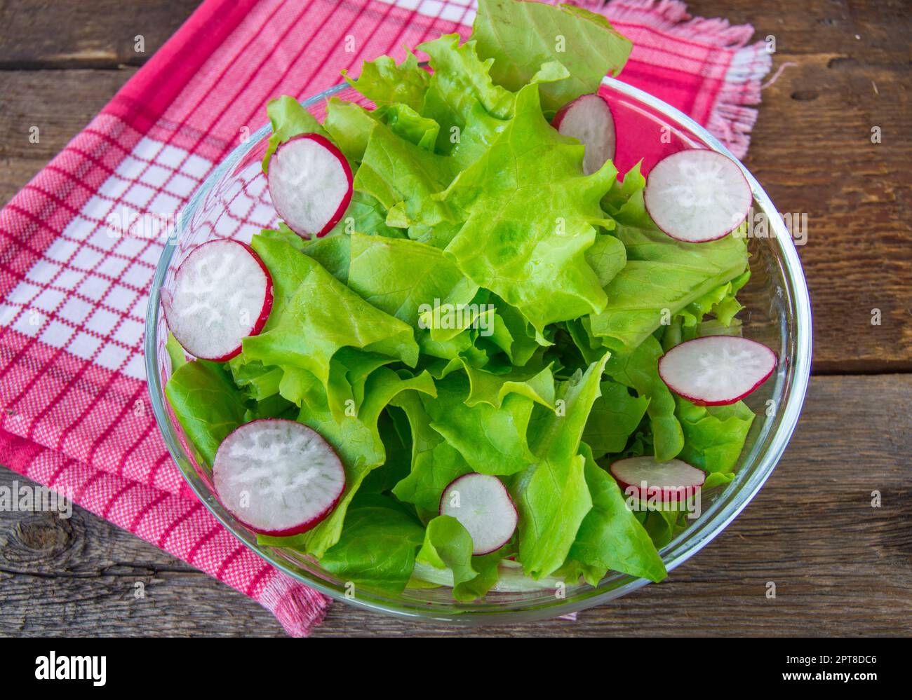 Healthy eating. Diet salad with radish, lettuce and olive oil Stock ...