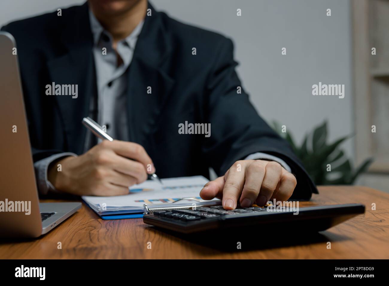 Business man investment finance calculating graph documents and report ...