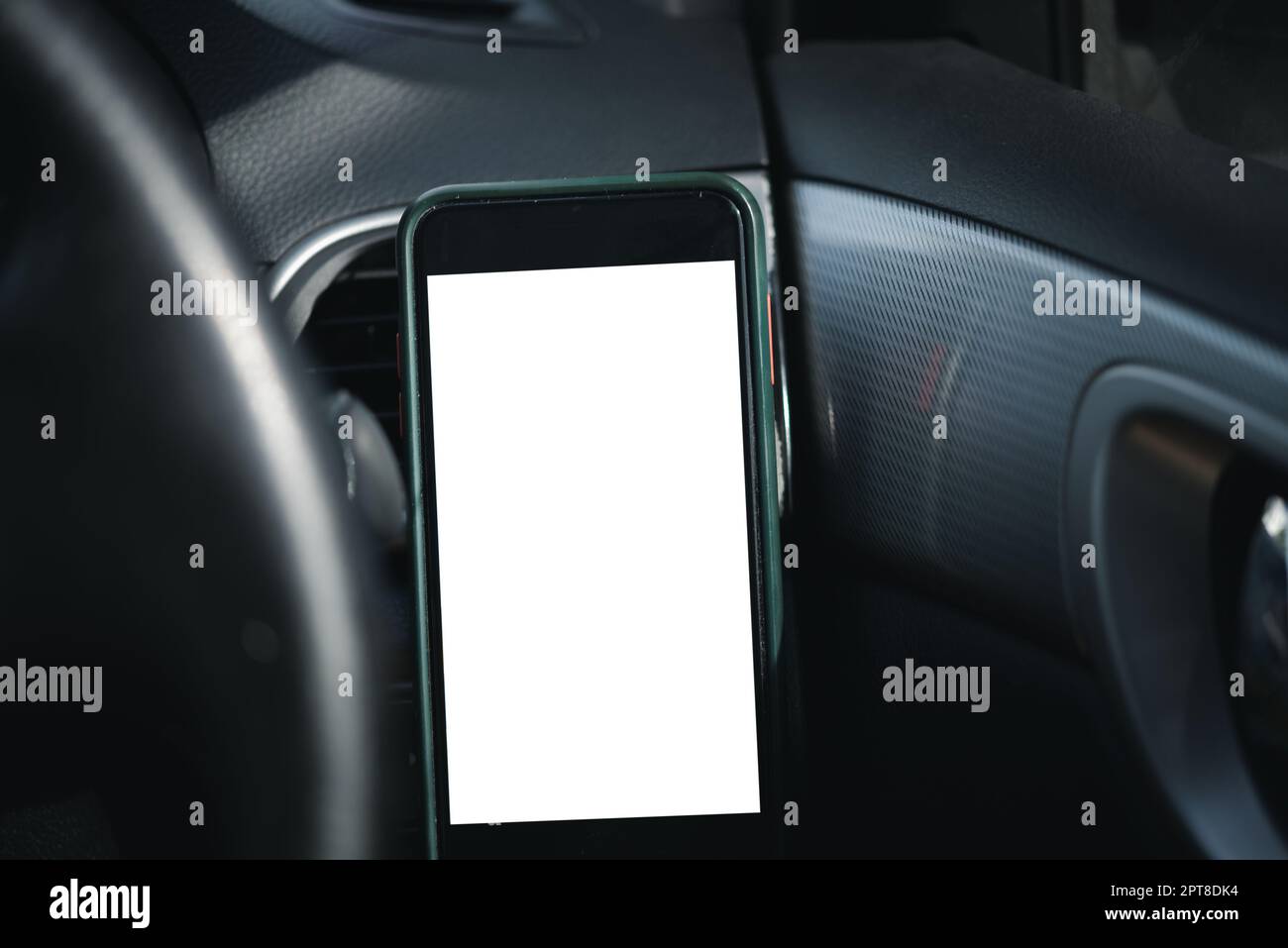 Mobile phone on the car air vent.Blank with white screen.Mock up smart ...