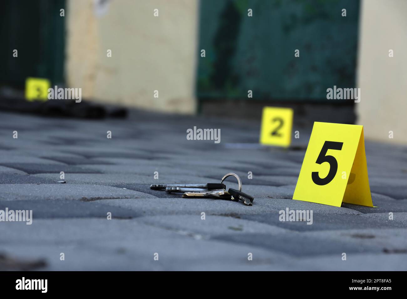 Evidence with yellow CSI marker for evidence numbering on the ...