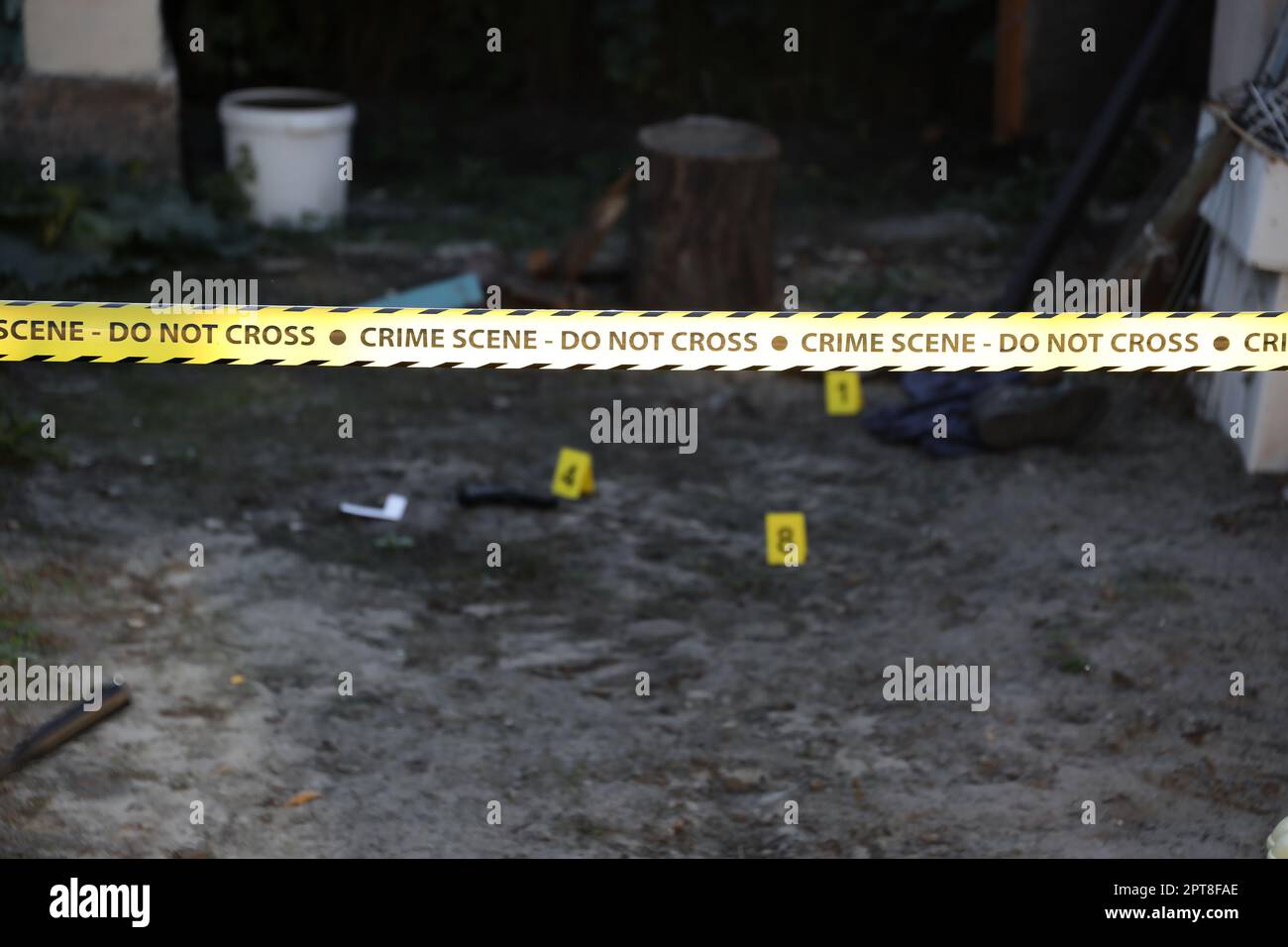 Crime scene tape for covering the area cordon. Yellow tape with blurred ...