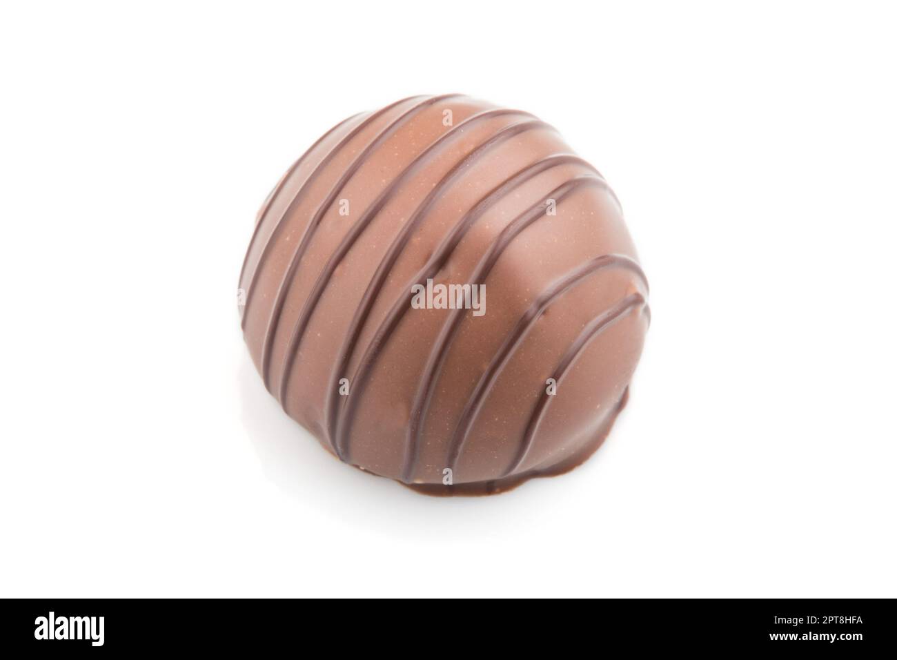 Single chocolate candy isolated on white background. side view, close ...