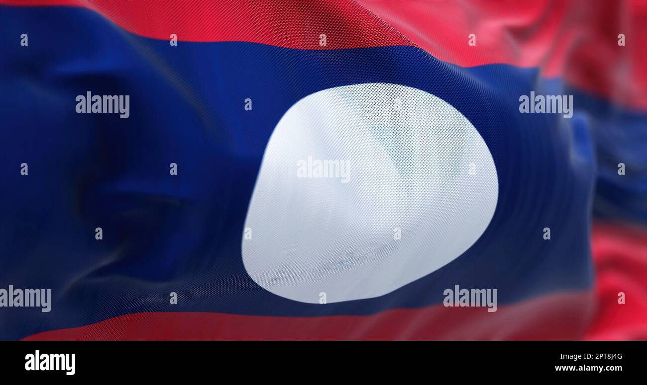 Close-up view of the Laos national flag waving in the wind. The Lao ...