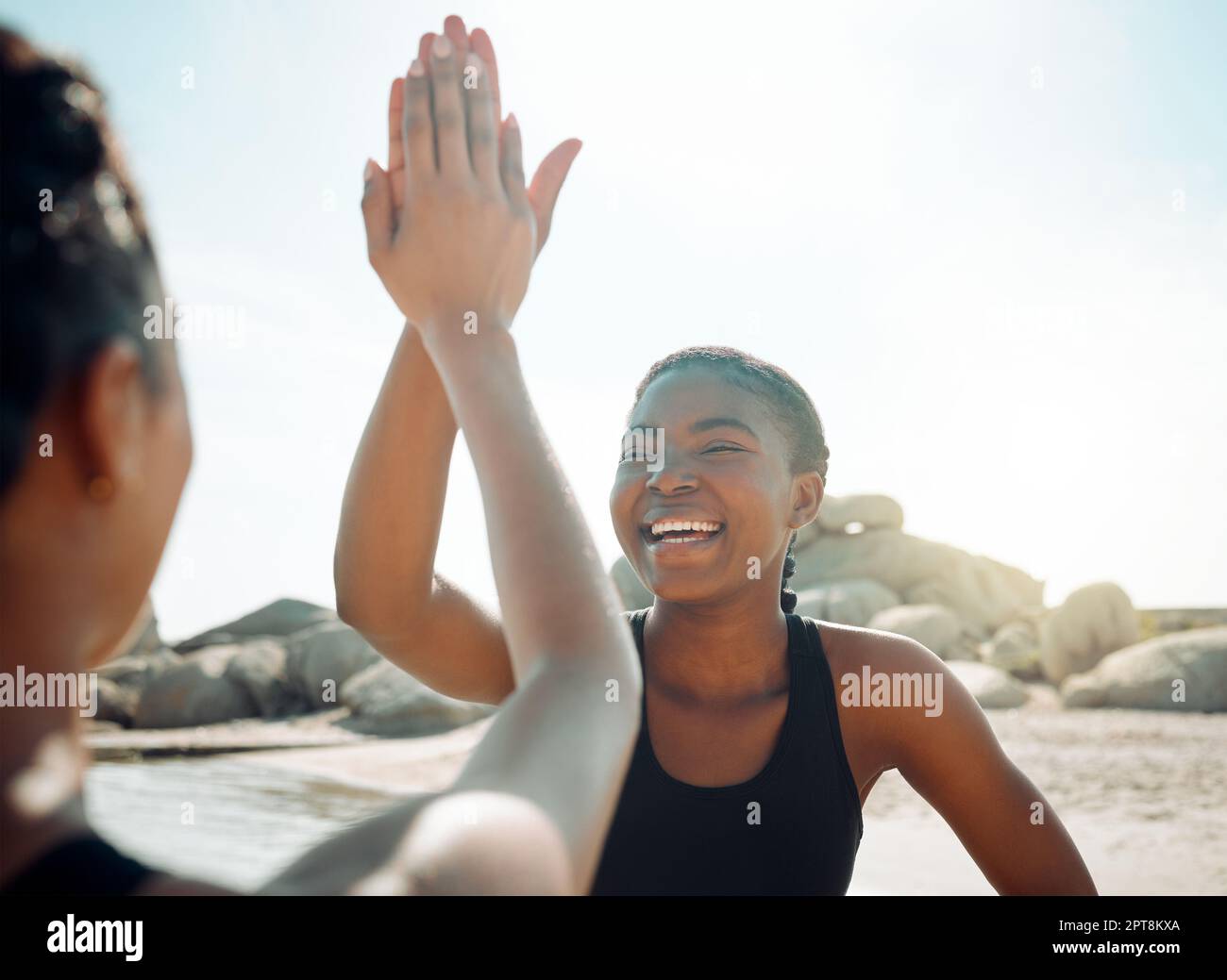Are you ready to do this. two friends high fiving after a workout Stock Photo - Alamy