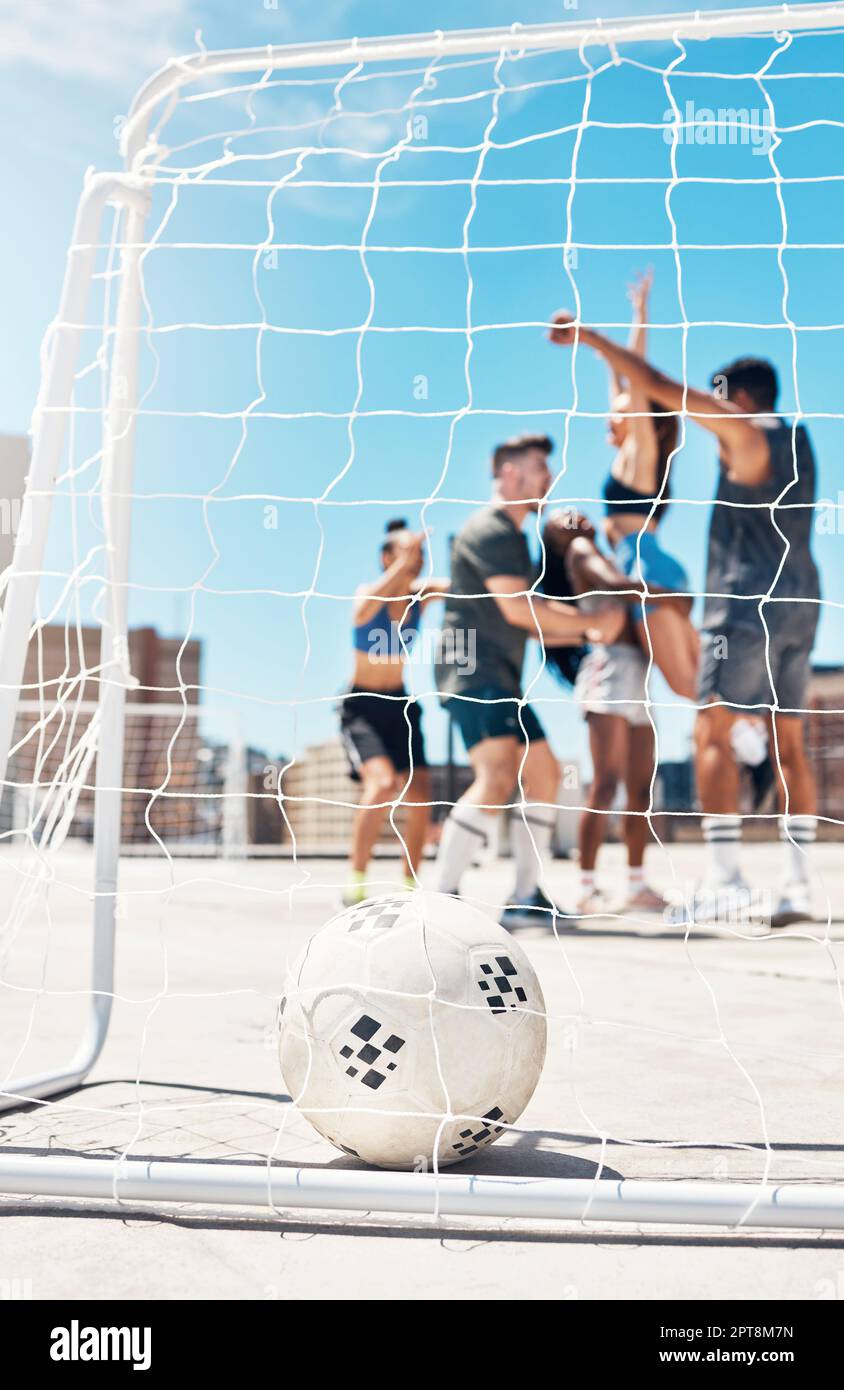 Football, soccer team and ball in goal post or net with diversity ...
