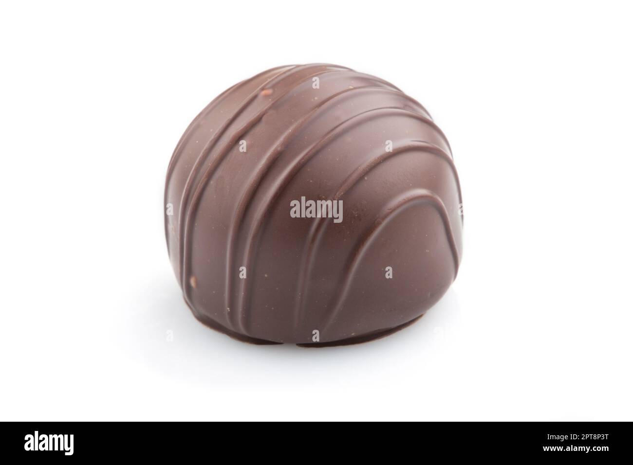 Single chocolate candy isolated on white background. side view, close ...
