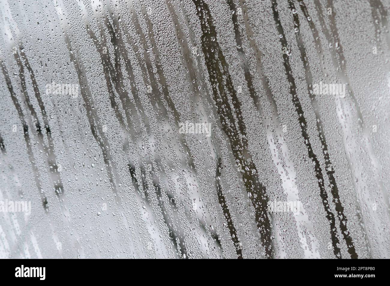 The texture of a misted glass with a lot of drops and condensation ...