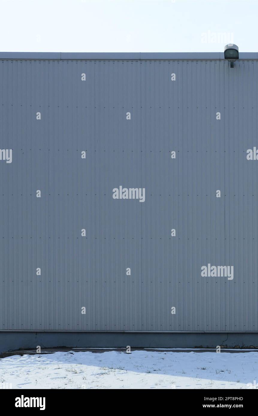 Texture of a high metal wall of an industrial building without windows ...