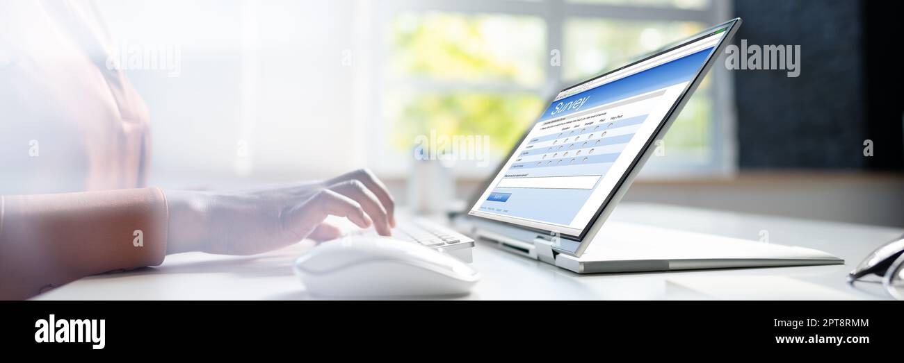 African Woman Filling Survey Poll Or Form On Laptop Computer Stock ...