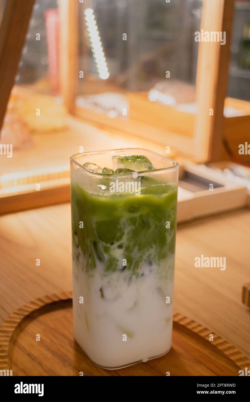 Melted iced green tea latte , stock photo Stock Photo - Alamy