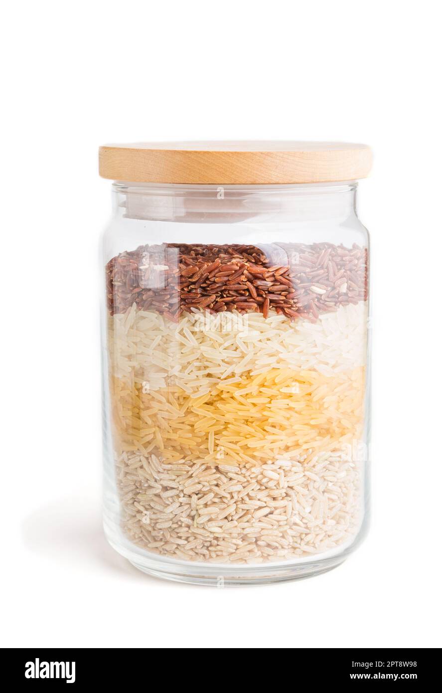 glass jar with different kinds of rice poured in layers isolated on ...
