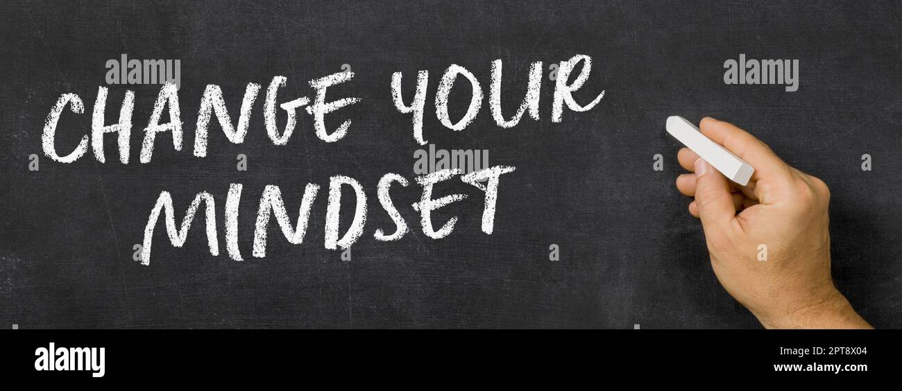 Text written on a blackboard - Change your mindset Stock Photo - Alamy