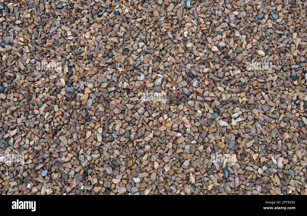 red gravel texture useful as a background Stock Photo - Alamy