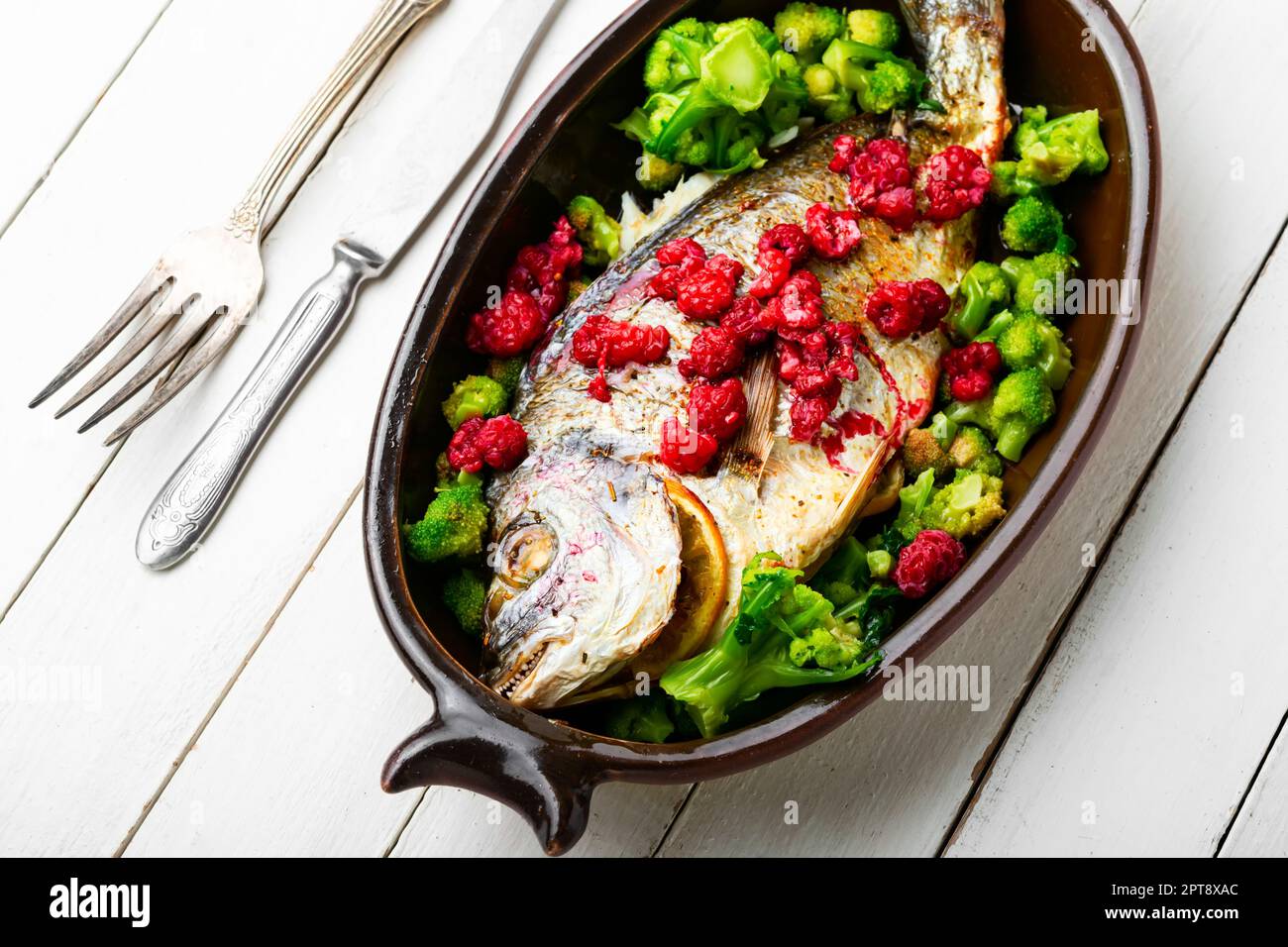 Appetizing grilled fish in fruit marinade. Seafood Stock Photo - Alamy