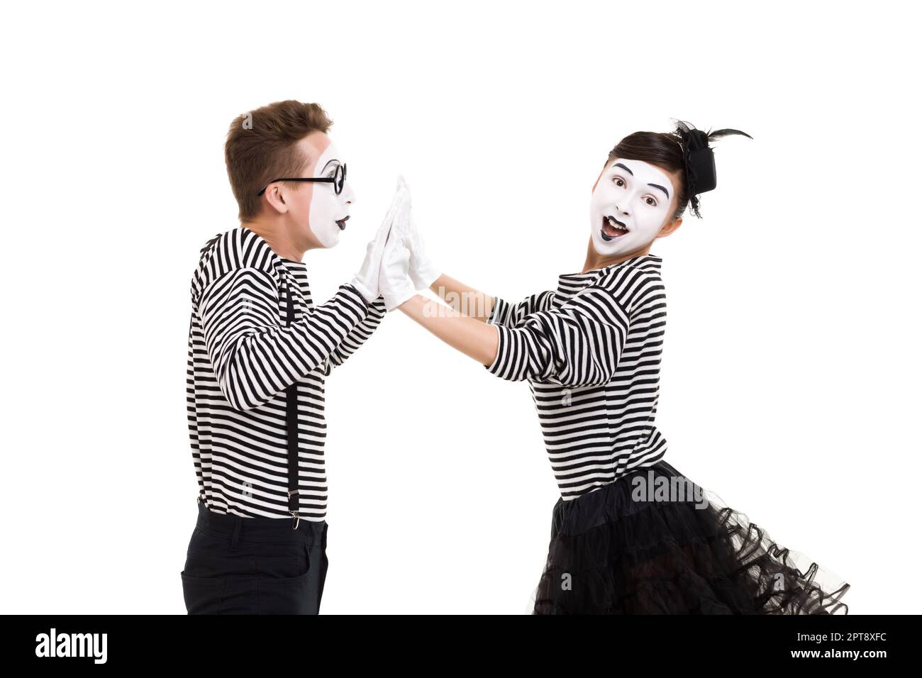 Smiling mimes in striped shirts. Man and woman dressed as actors of ...