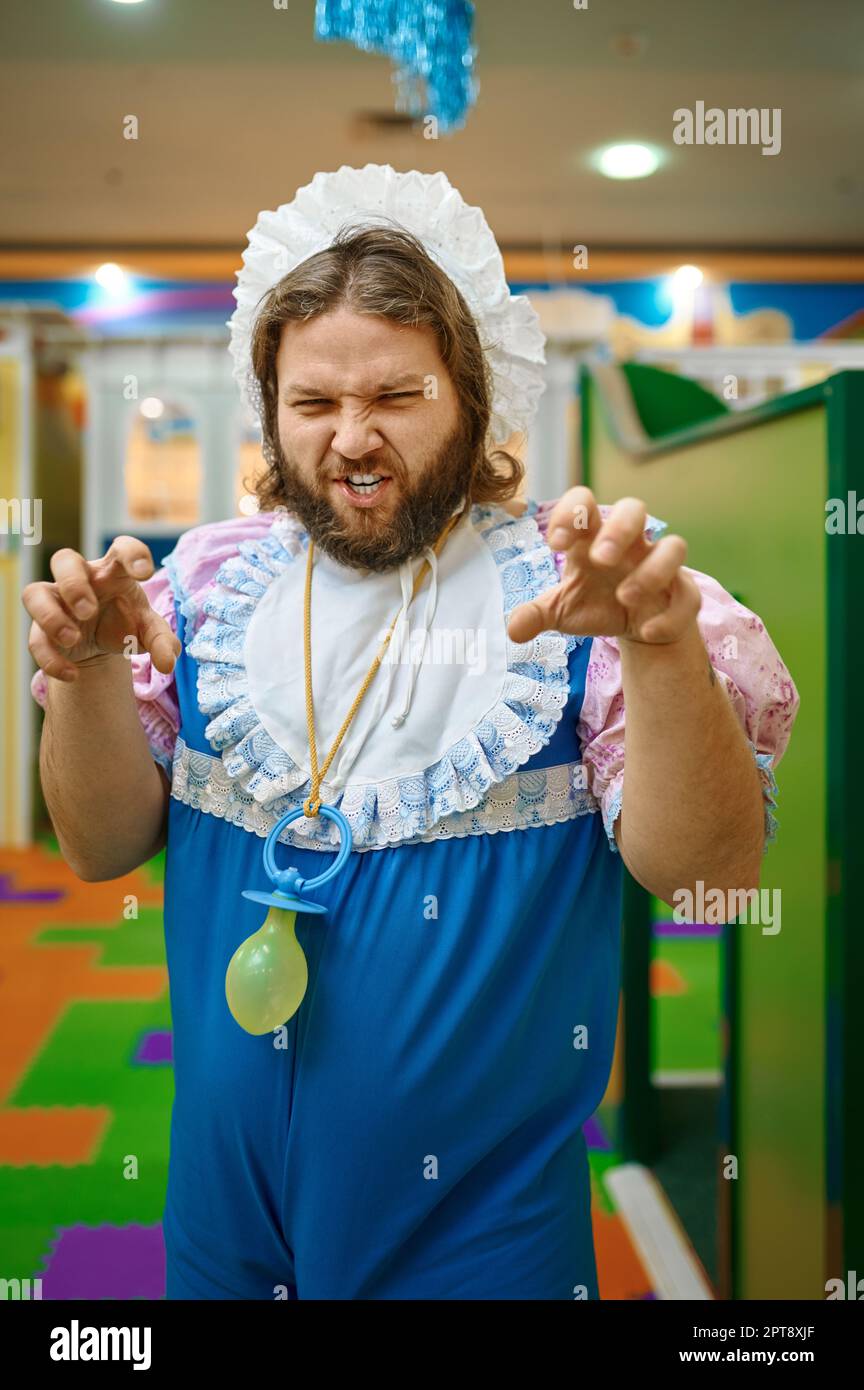 Funny man like little baby grimacing at children amusement park ...