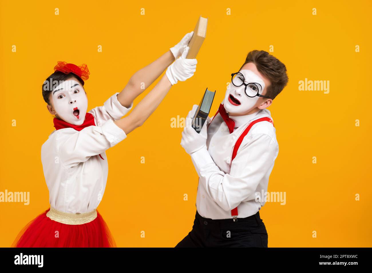 portrait of mime couple artist quarreling and reading book isolated on ...