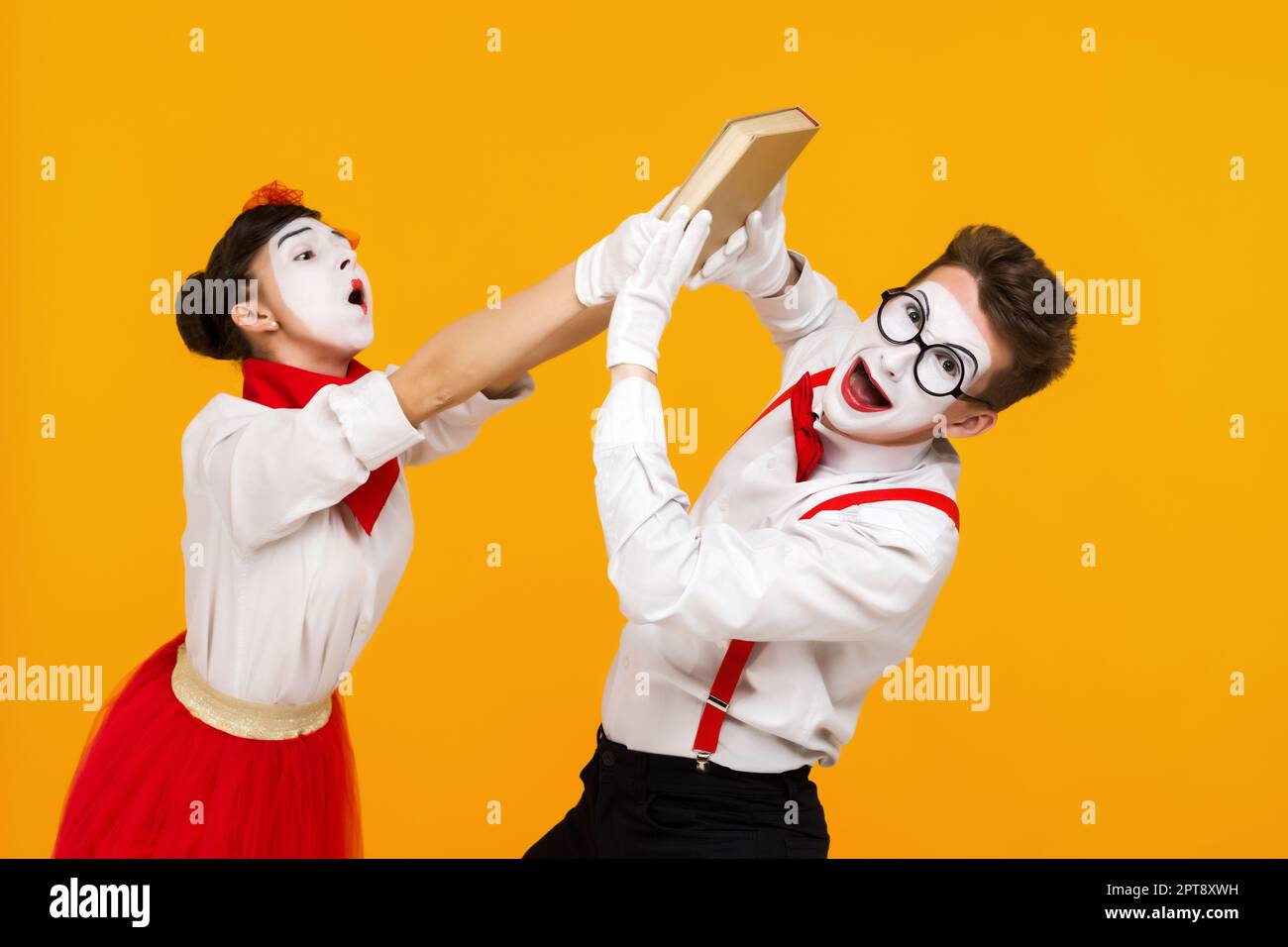 portrait of mime couple artist quarreling and reading book isolated on ...