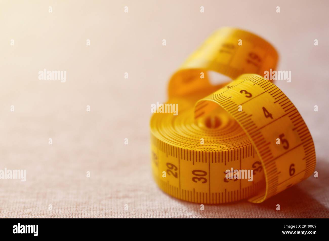 The measuring tape of yellow color with numerical indicators in the ...