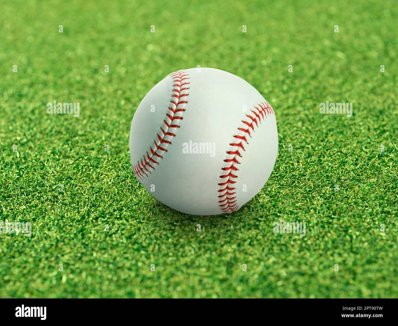 Baseball on the clear green grass turf close-up Stock Photo - Alamy