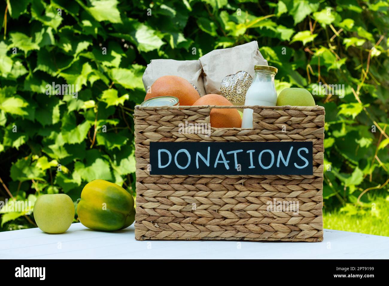 Cereals, canned food, milk, vegetables and fruits in a box for food ...