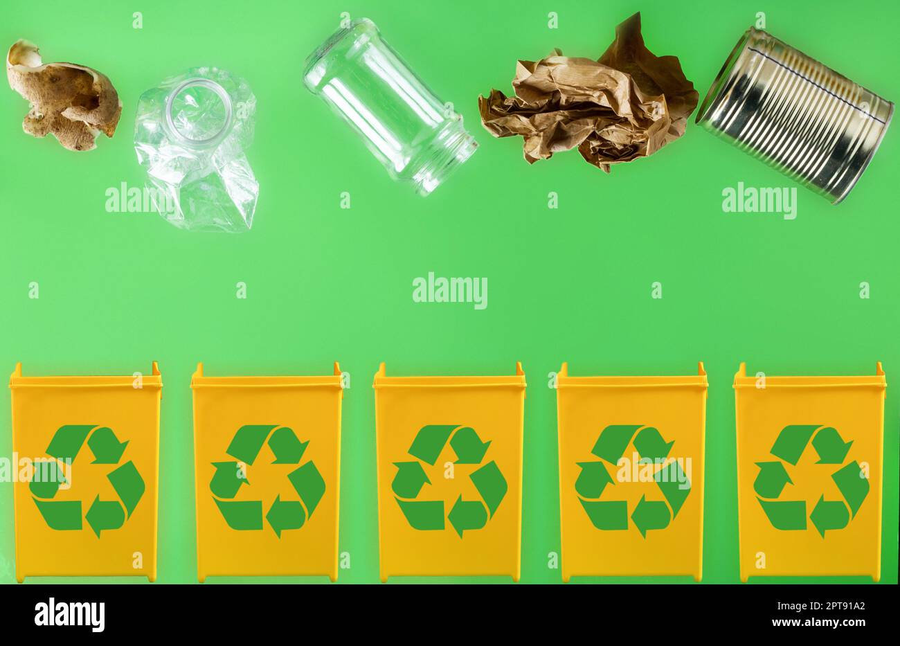 Throwing paper, metal, glass, plastic, organic garbage into different ...