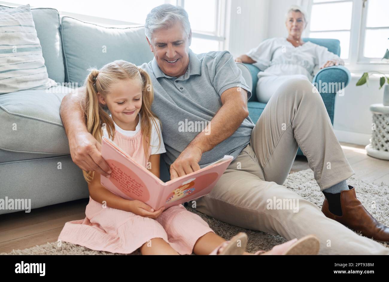 Book, child and grandfather reading a story for education, knowledge ...