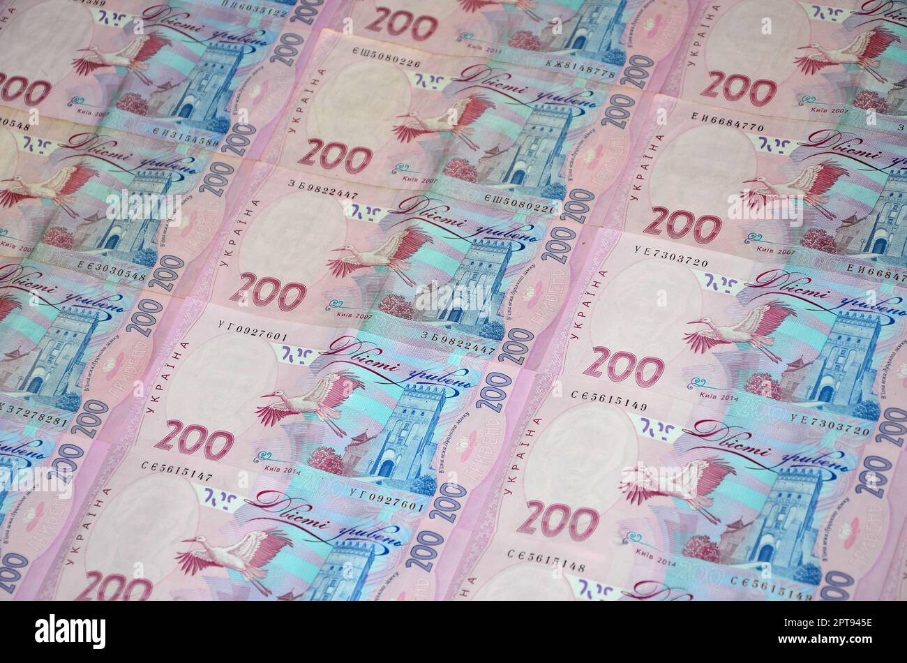 A close-up of a pattern of many Ukrainian currency banknotes with a par ...