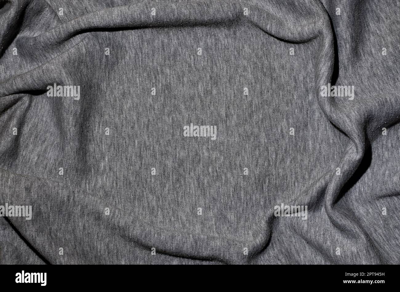 Close-up of rumpled heater and knitted sport jersey or hoodie fabric ...