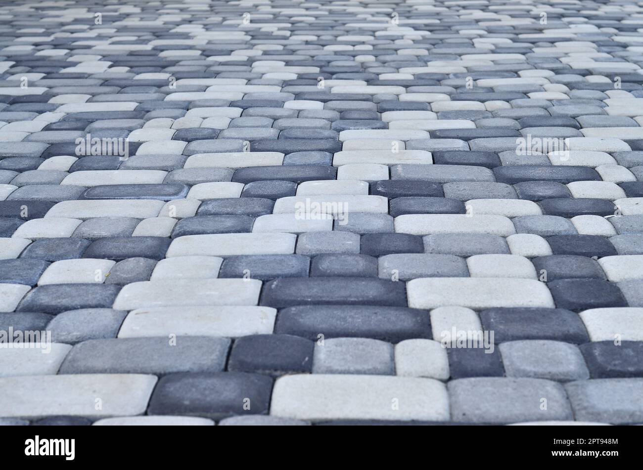A detailed photo of the square, laid out of modern paving stone with ...