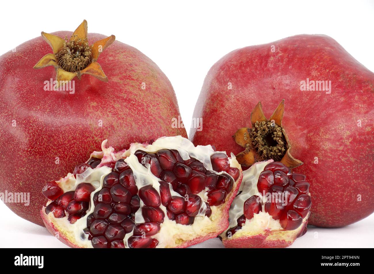 Fresh ripe pomegranate fruits isolated on white background Stock Photo ...