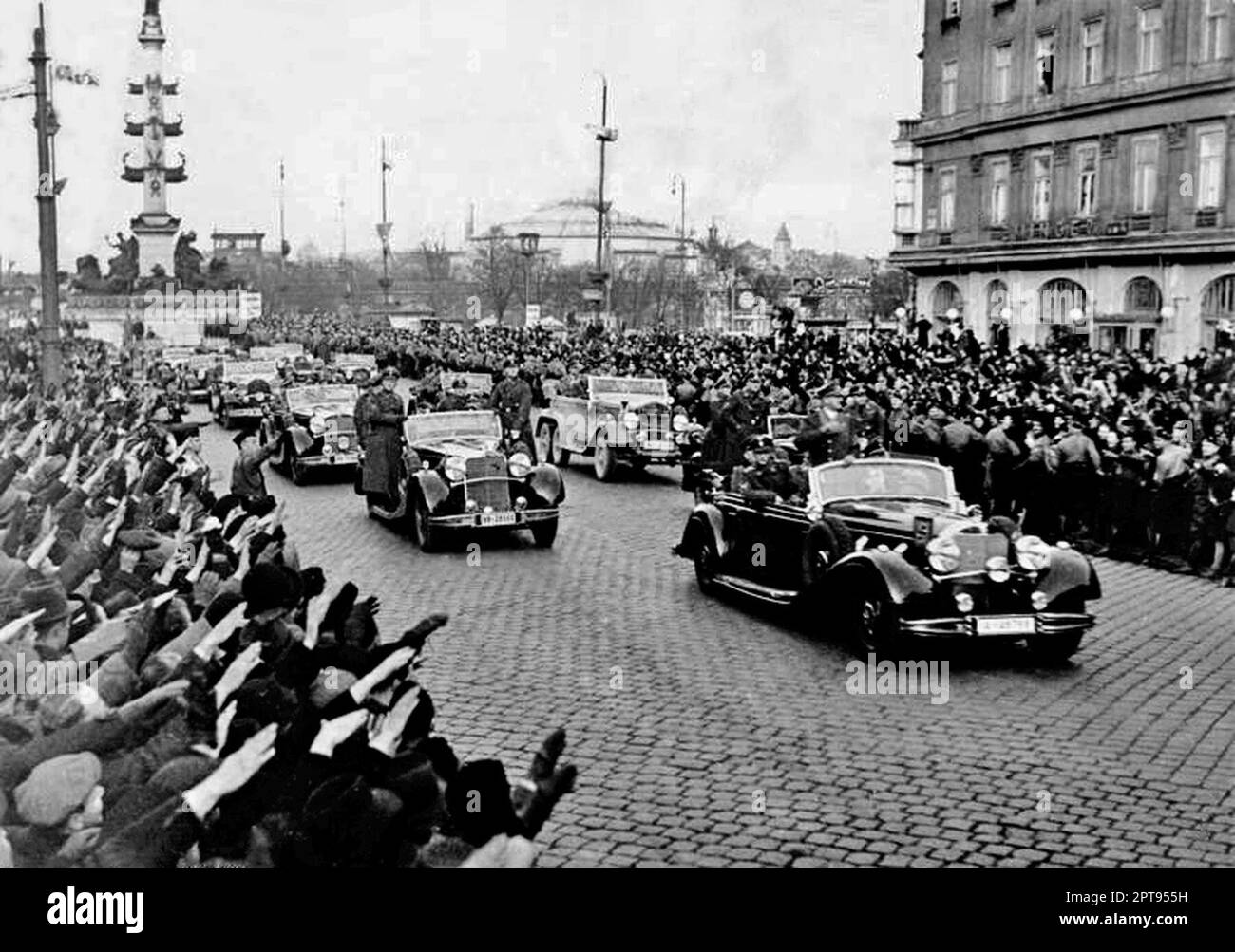 Jubilant crowds cheering the Hitler's motorcade entering Praterstraß in ...