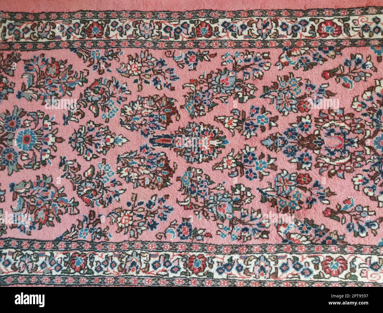 Patterns in the hand-embroidered Iranian carpet Stock Photo - Alamy