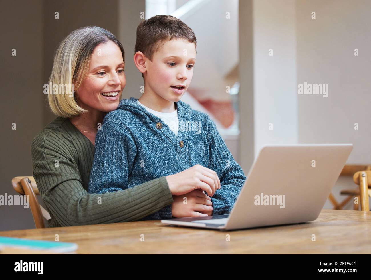 Cute mother son doing homework hi-res stock photography and images - Alamy