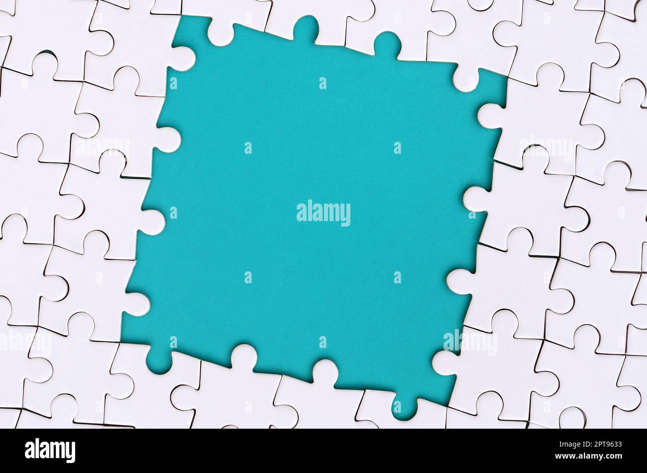 Framing in the form of a rectangle, made of a white jigsaw puzzle ...