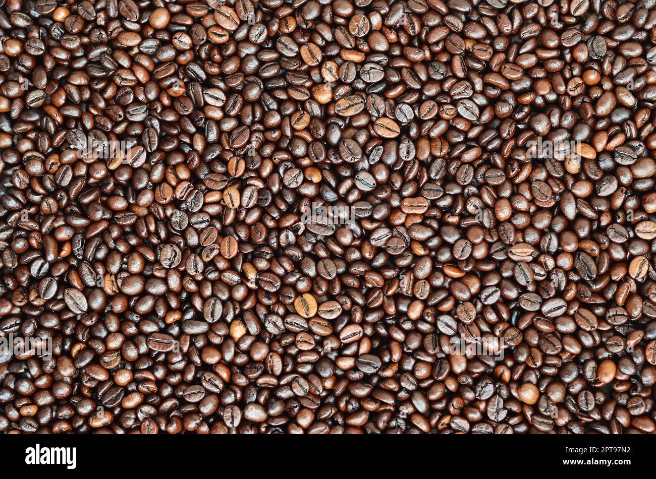 Background texture of a huge number of fragrant and fresh brown roasted ...