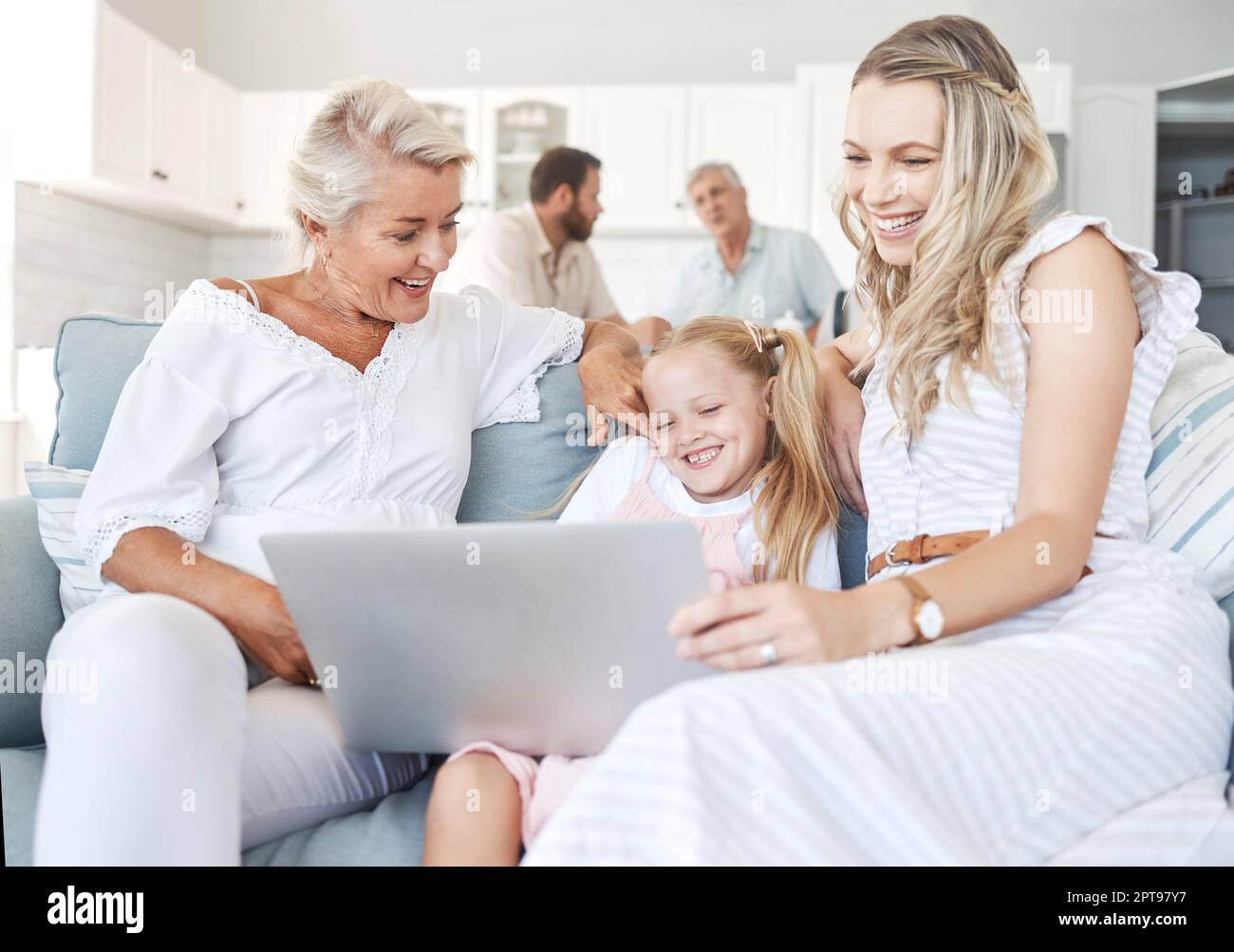Family relax in home, child on laptop with mother in living room or ...