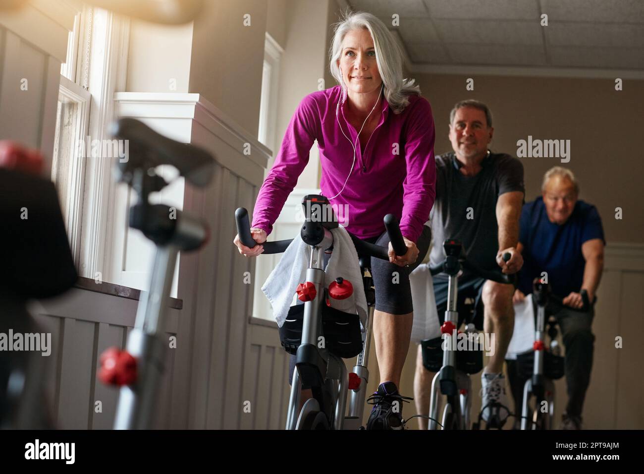 Spin together to win together. a group of seniors having a spinning ...