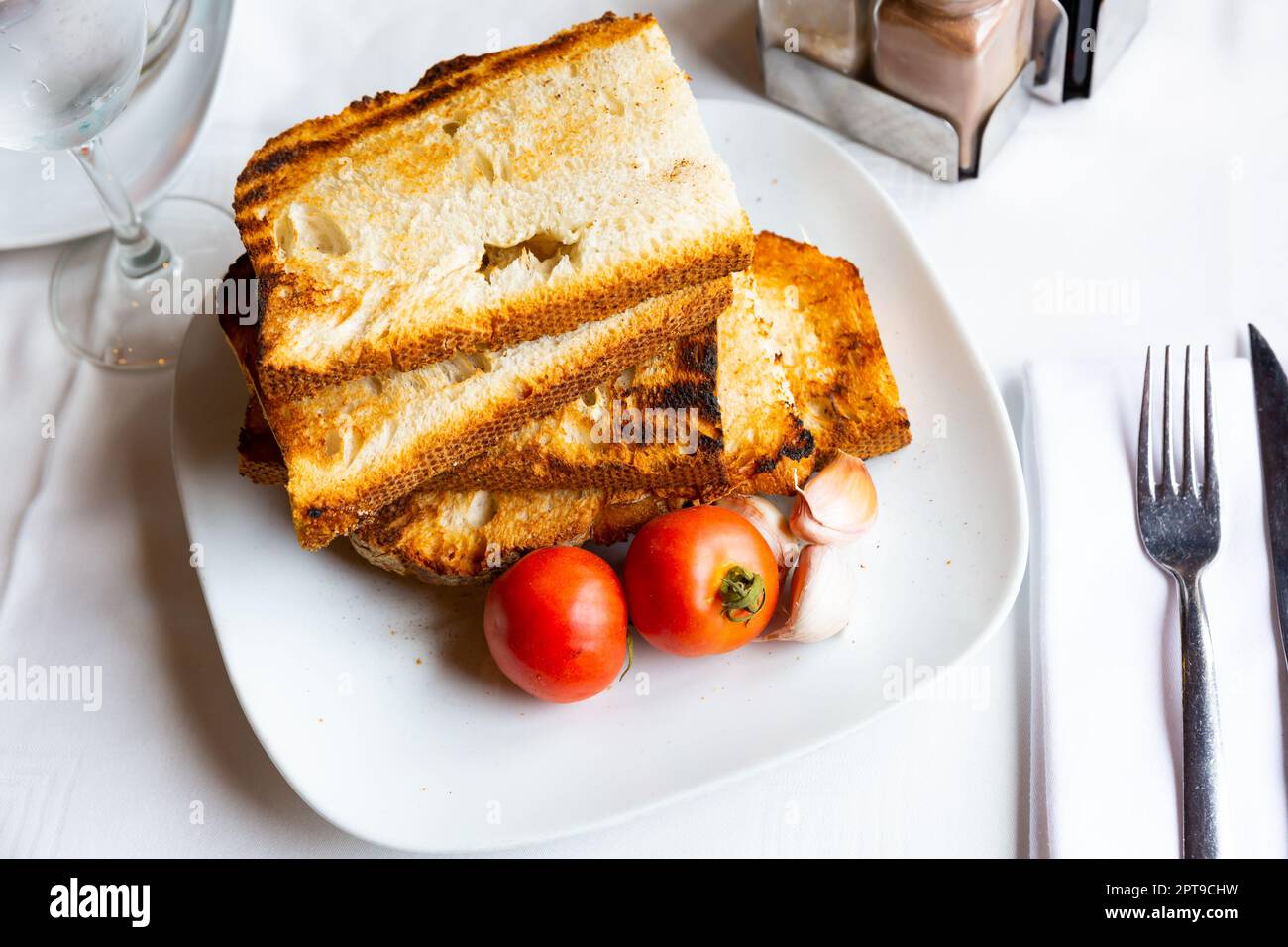 Traditional Catalan food, pan con tomate, served on plate Stock Photo ...