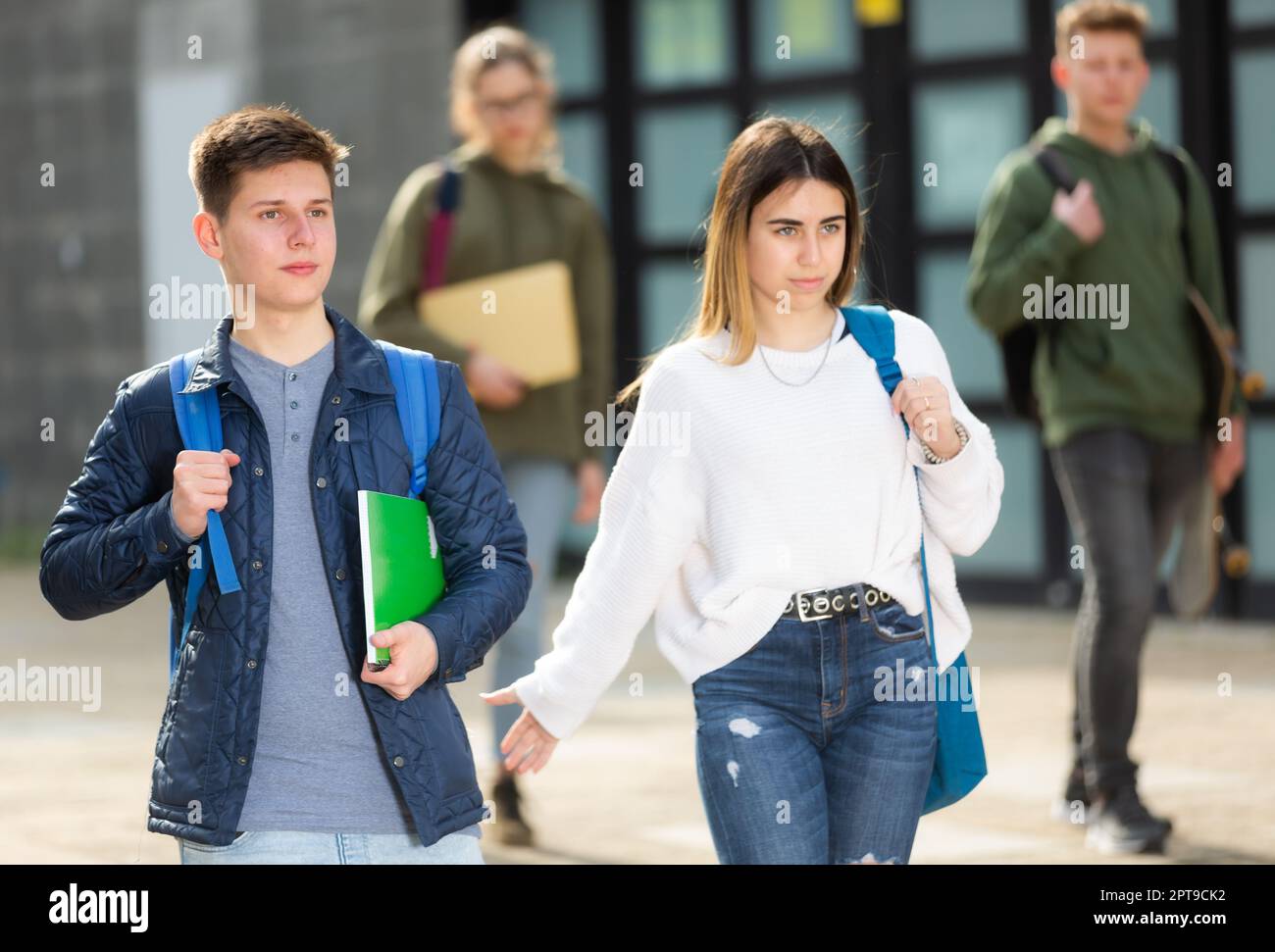 Carefree teen students boy and girl friendly talking Stock Photo - Alamy