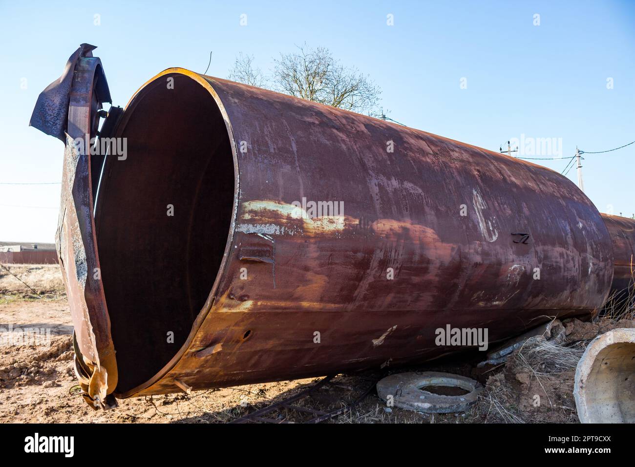 Old rusty water tower lying on the ground Stock Photo - Alamy