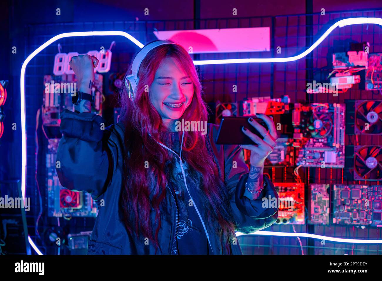 Winning. Young woman feeling excited at gaming room, Happy gamer people ...