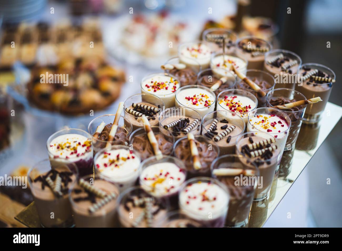 Delicious wedding reception candy bar dessert table with various sweets ...