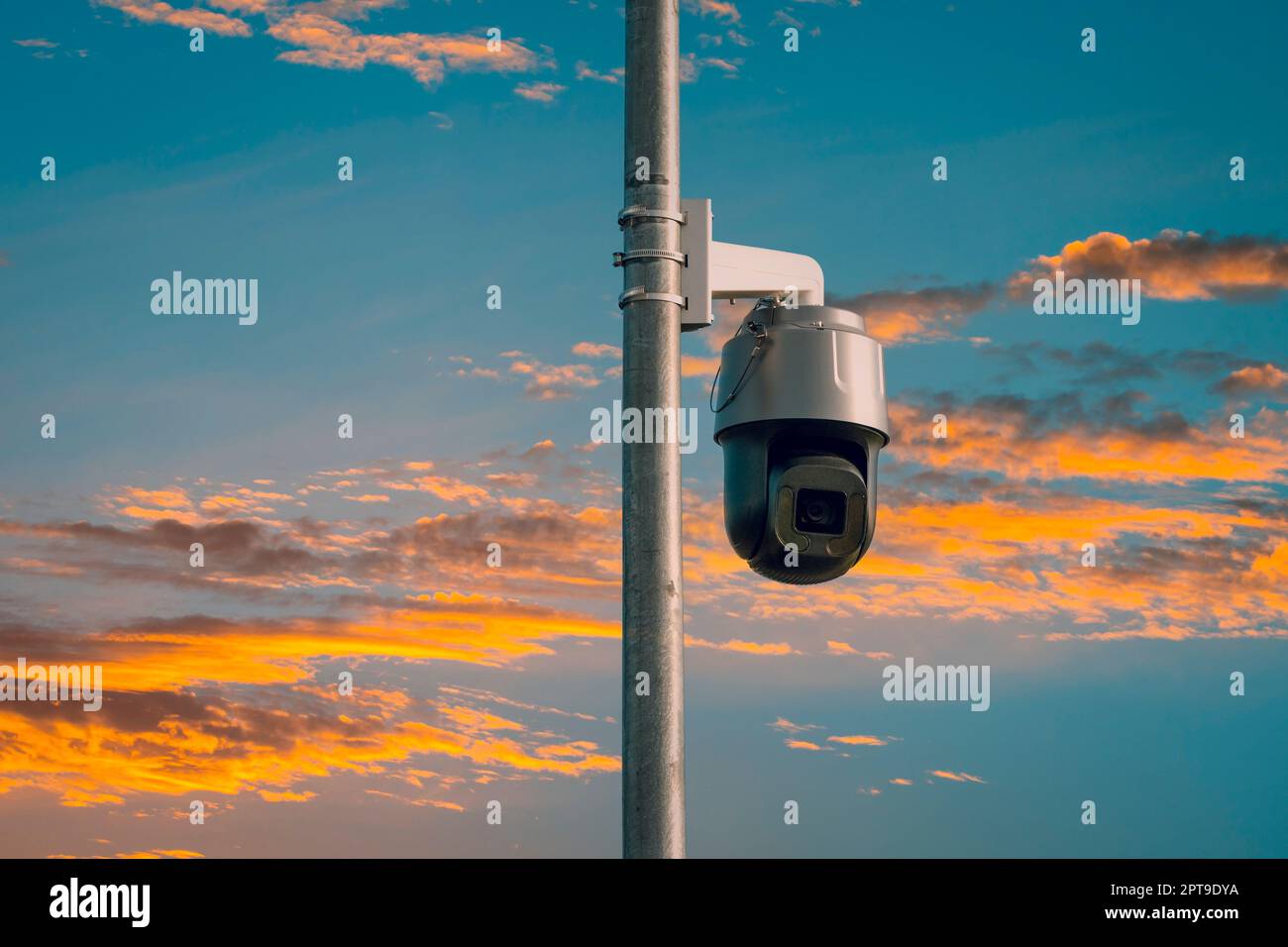 Security CCTV camera on a pole with sunset sky. The concept of surveillance evening time Stock ...