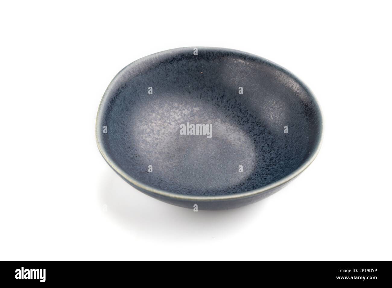 Empty blue ceramic bowl isolated on white background. Side view, close ...